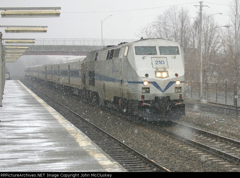 MNCR 210 in a snow shower